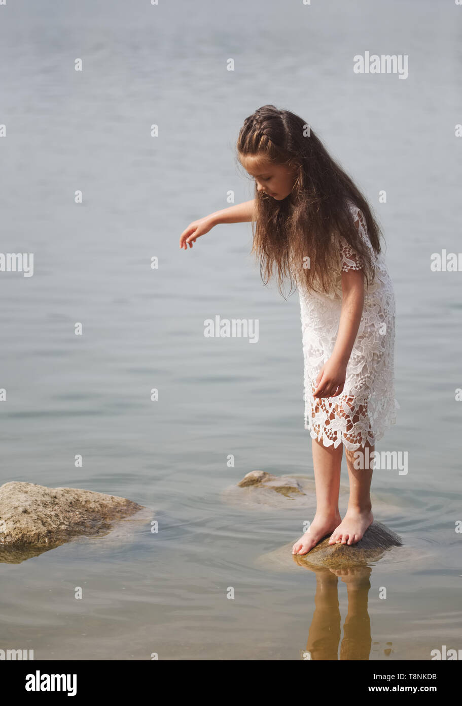 cute happy little girl in sumer lake Stock Photo - Alamy
