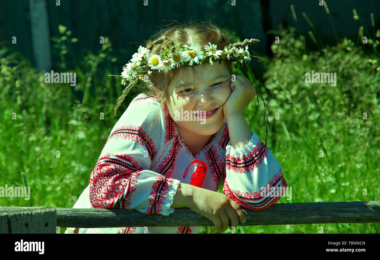little Slavic girl in national dress in Russian village Stock Photo - Alamy