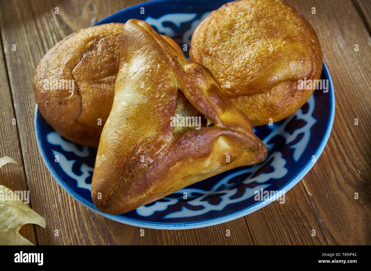 Ocpochmaq, triangular pastry, filled with minced beef, onion and ...