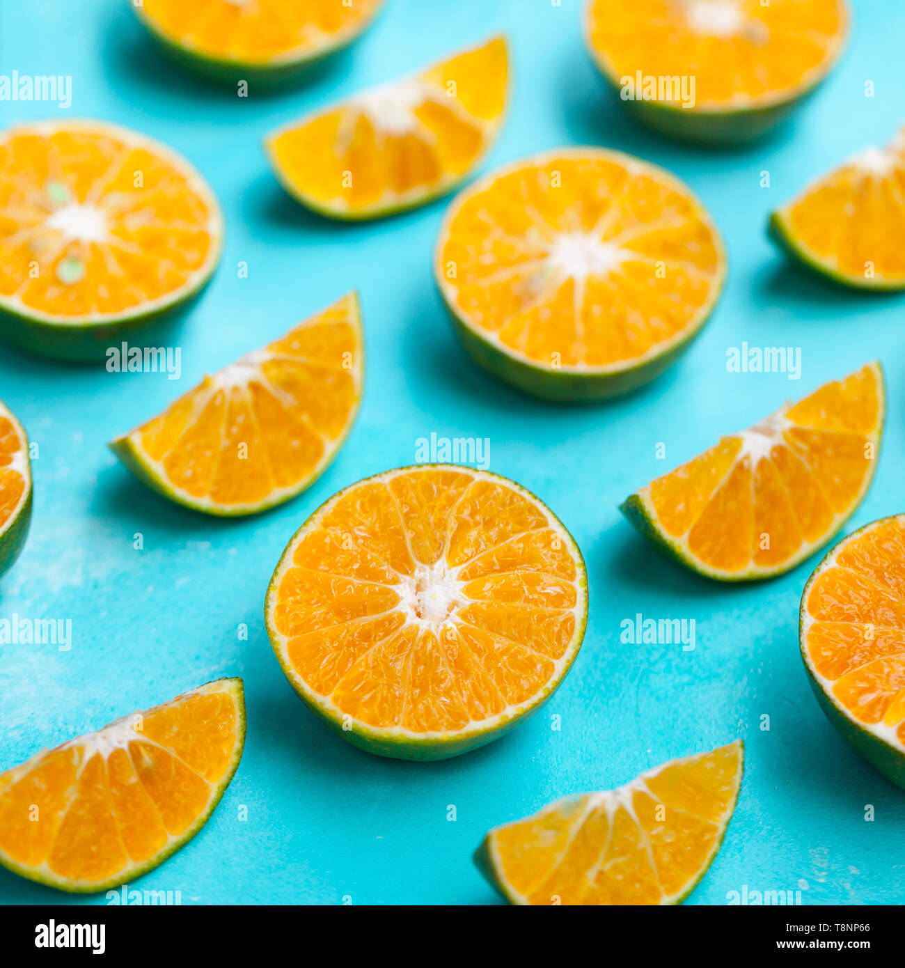 Oranges on blue background. Flat lay composition. Close up Stock Photo ...