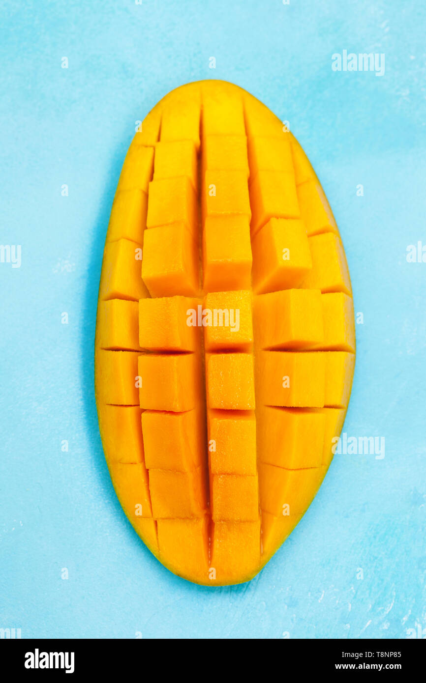 Fresh mango organic fruit on blue background. Top view. Close up Stock ...