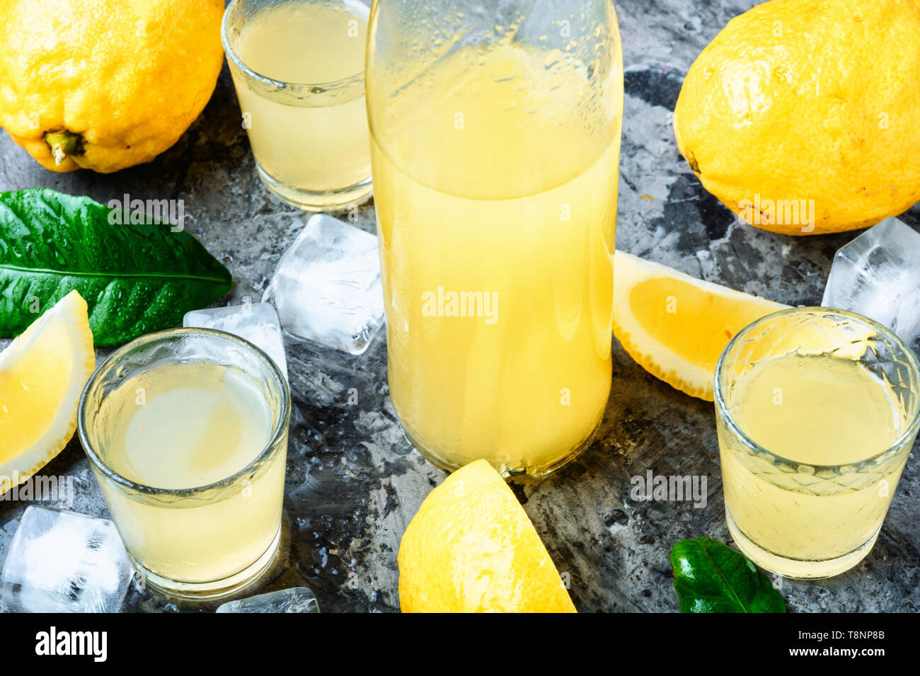 Traditional italian lemon liqueur limoncello and fresh lemon.Summer ...