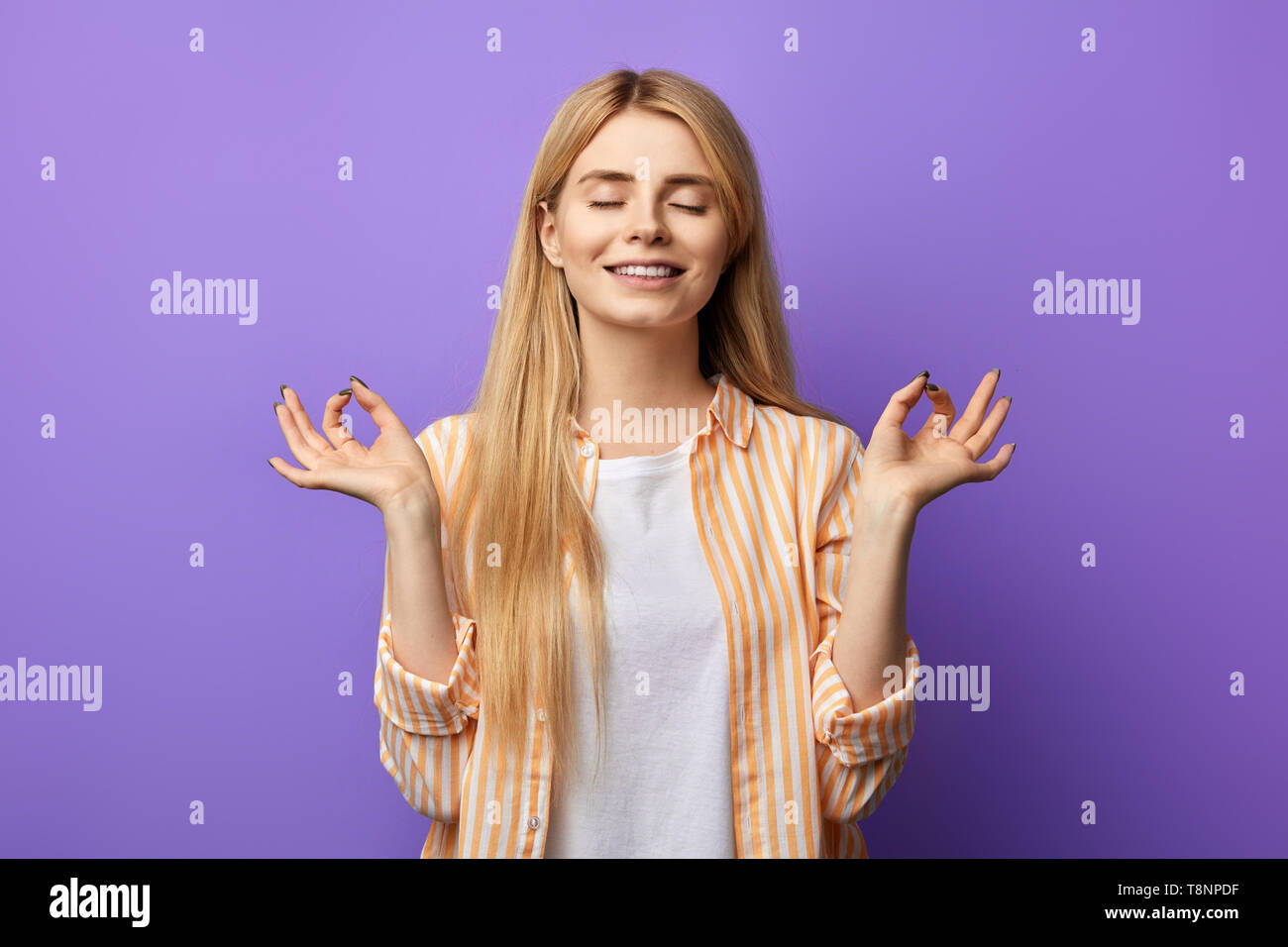 happy beautiful fair-haired woman enjoying the yoga pose. close up ...