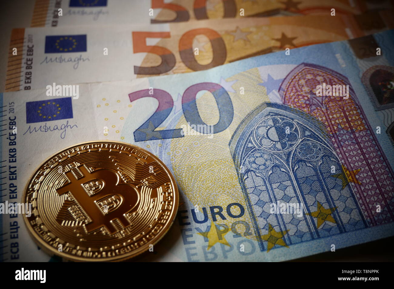 An golden Bitcoin, an virtual currency in physical coin form, displayed ...