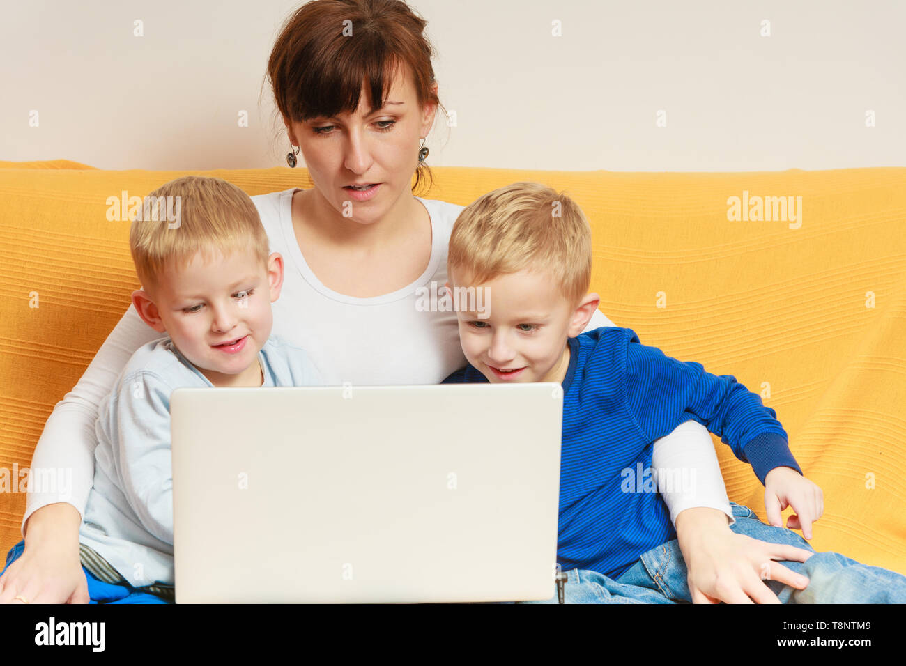Children and technology, family spending free time online concept. Two ...