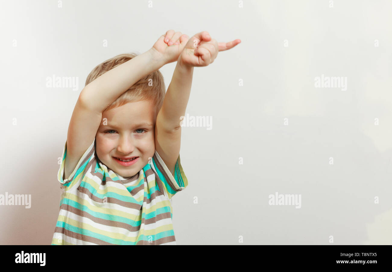 Face expressions, children concept. Portrait of happy kid boy looking ...