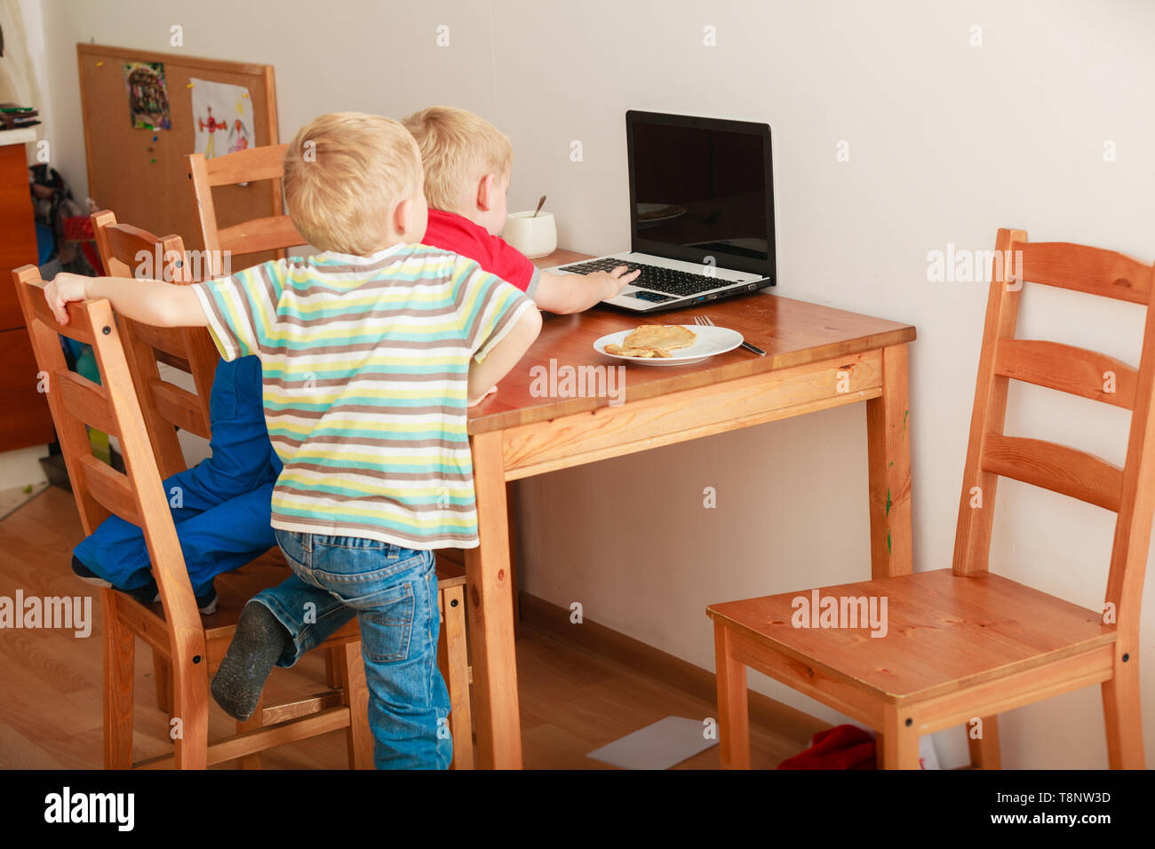 Children and technology, spending free time online concept. Two boys ...