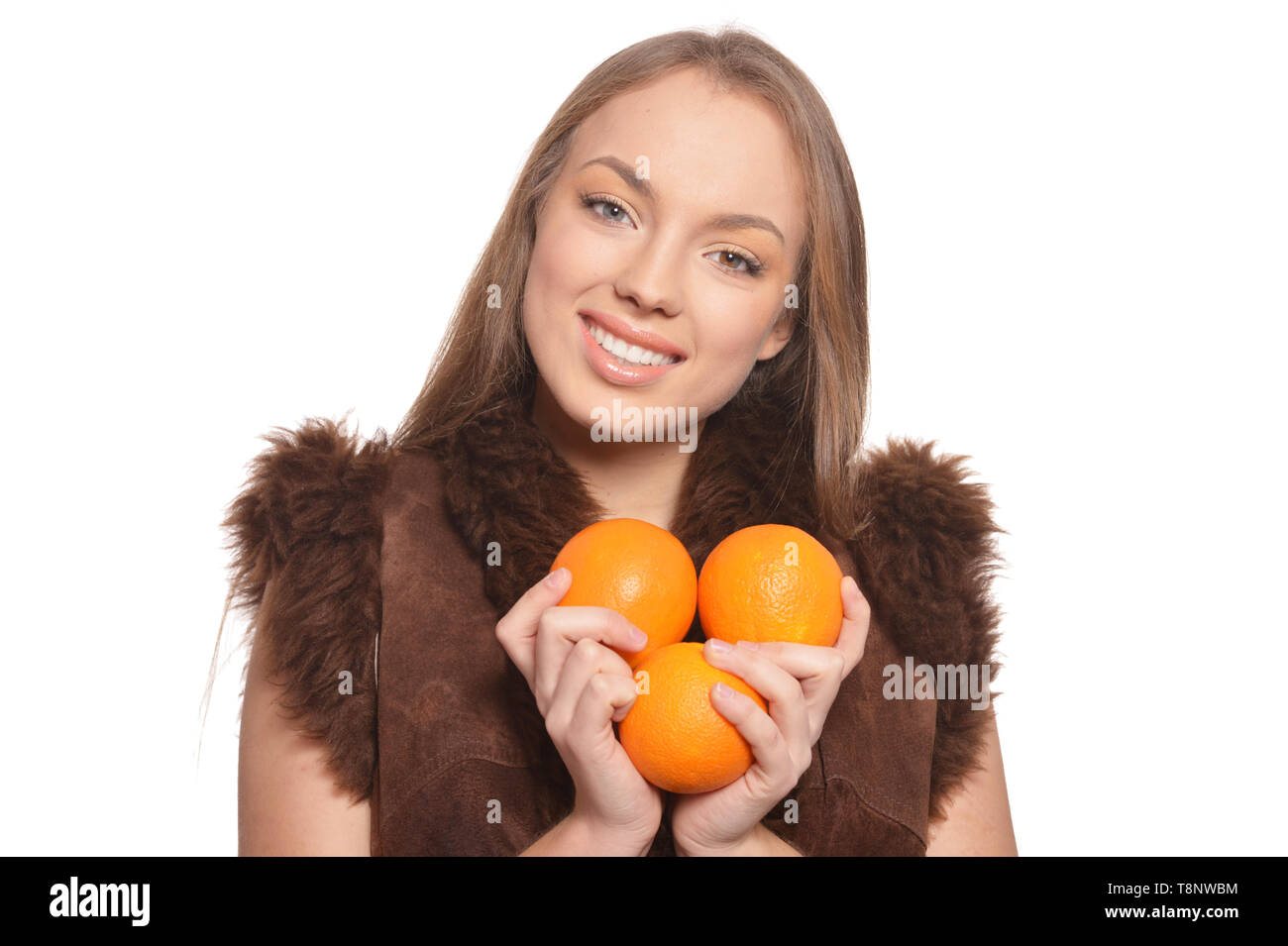 Portrait of young woman posing with oranges isolated Stock Photo - Alamy