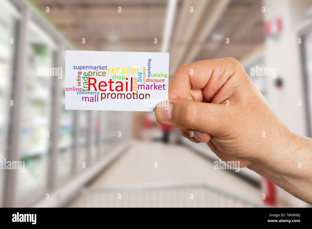 Hypermarket or supermarket employee man presenting white card with ...