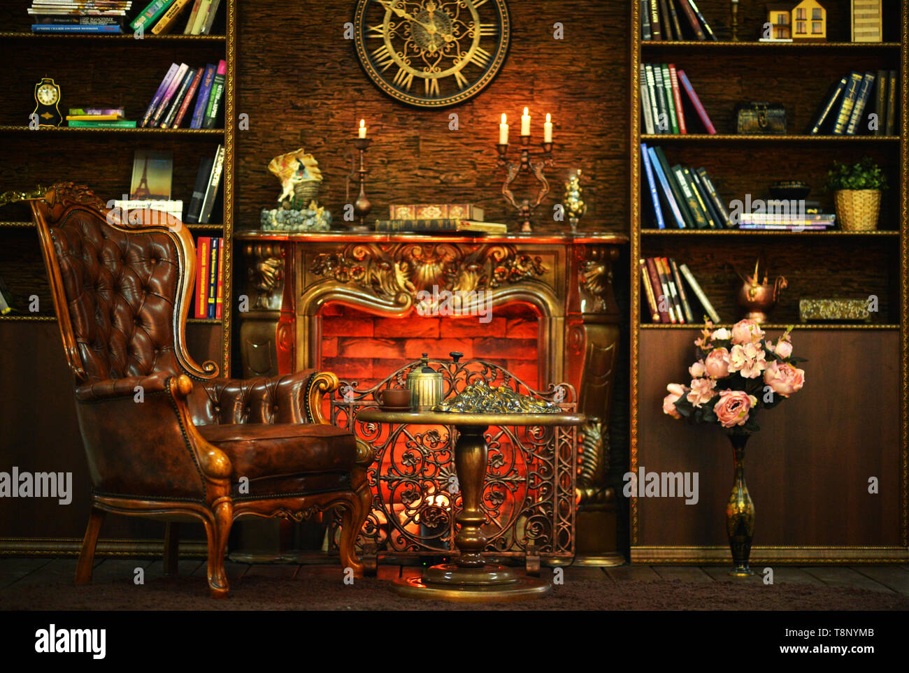 Brown leather chair and table in library at home Stock Photo - Alamy