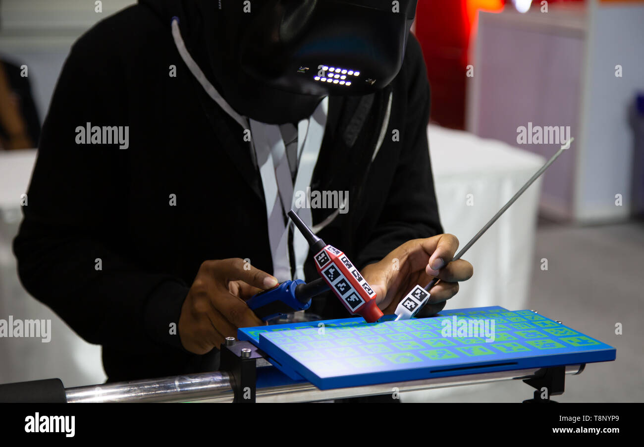 Welder training with welding simulator machine Stock Photo - Alamy