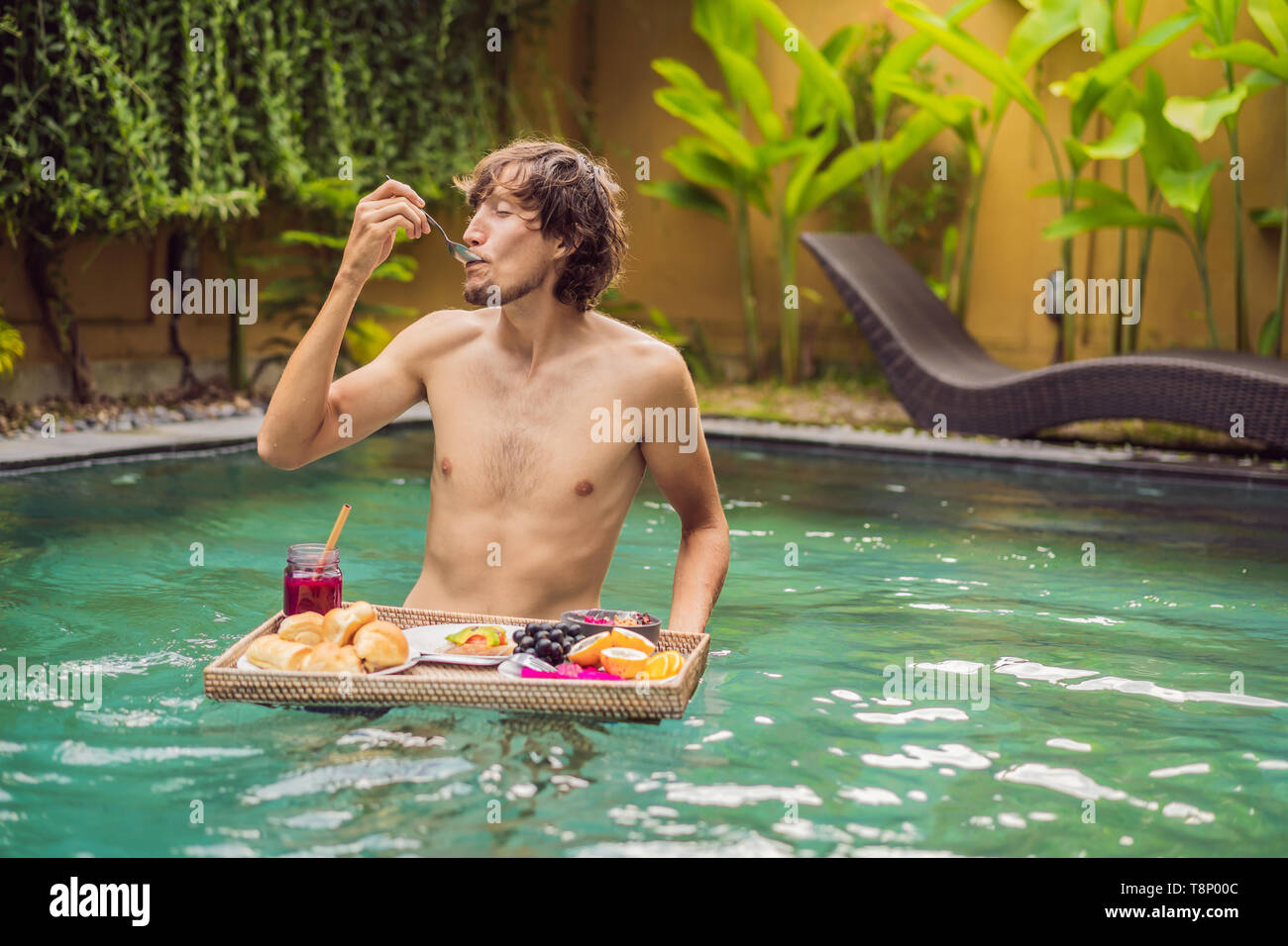 Breakfast tray in swimming pool, floating breakfast in luxury hotel ...