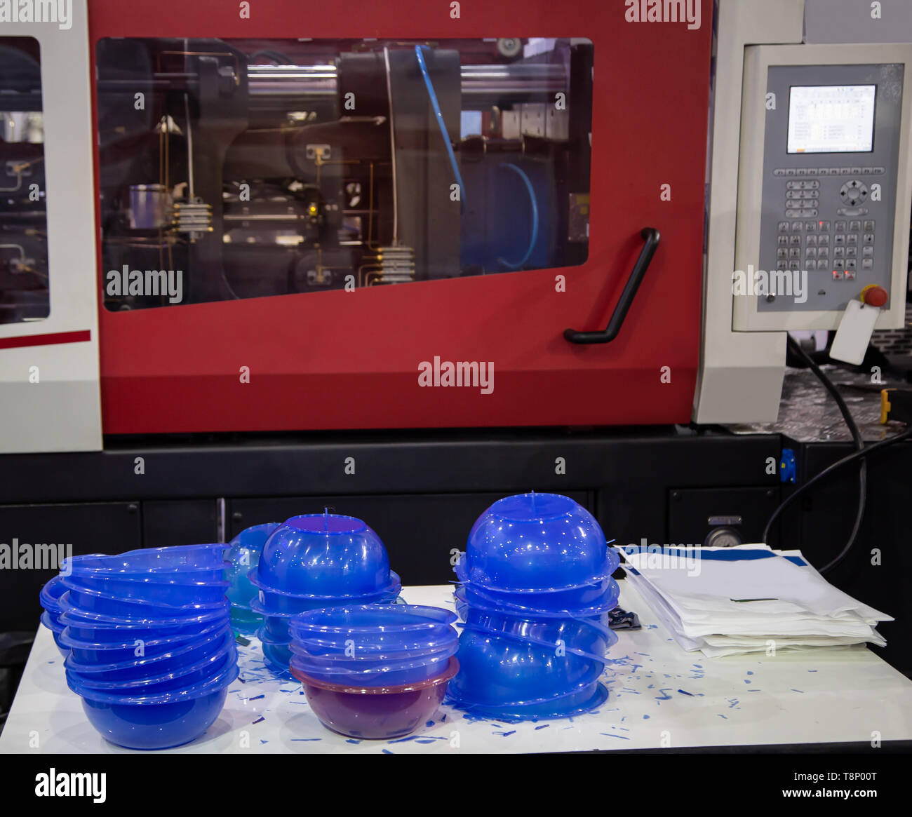 Plastic bowl product from plastic injection molding press machine Stock ...