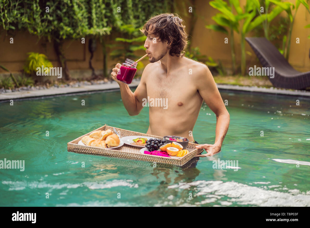 Breakfast tray in swimming pool, floating breakfast in luxury hotel ...