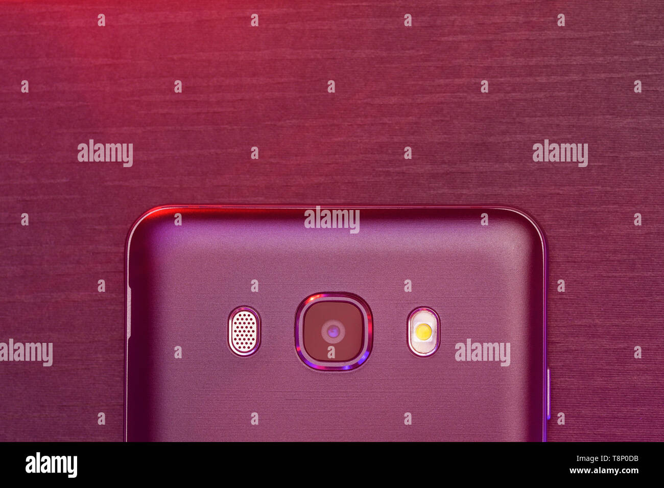 Close-up view of the top of the black smartphone on the camera and ...