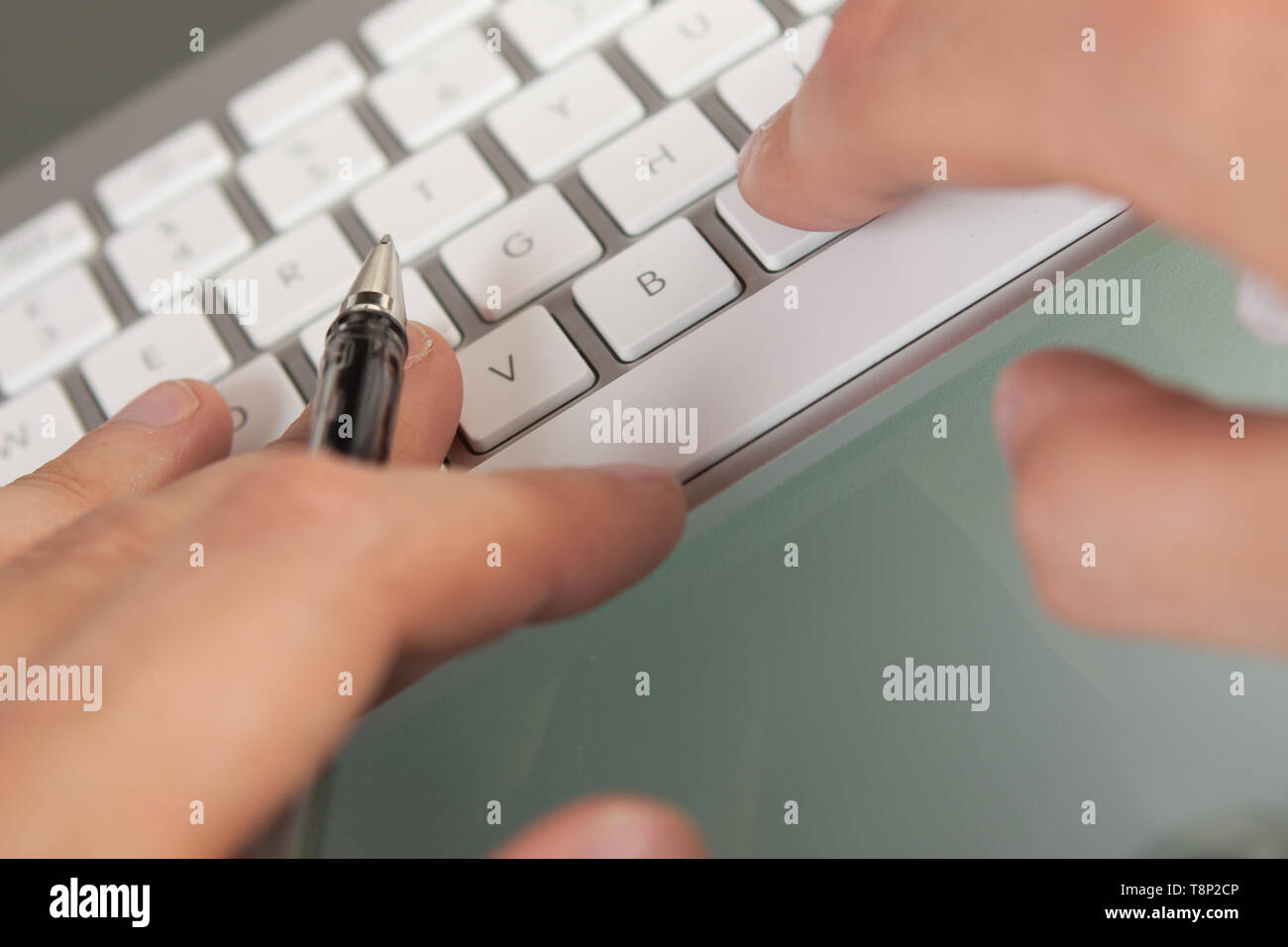 An office worker business person working at a desk using a computer ...