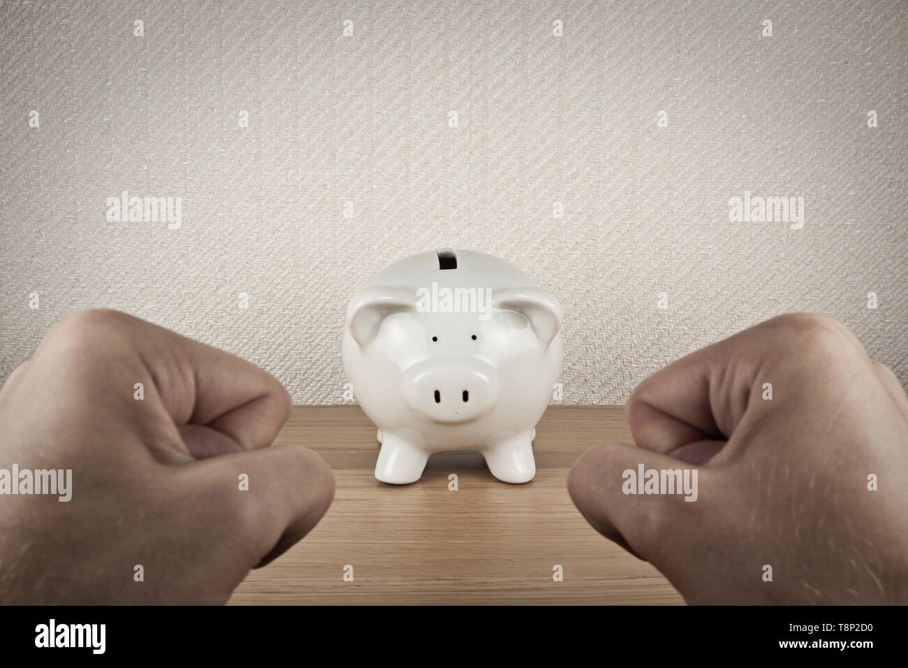 A piggy bank being mugged Stock Photo - Alamy