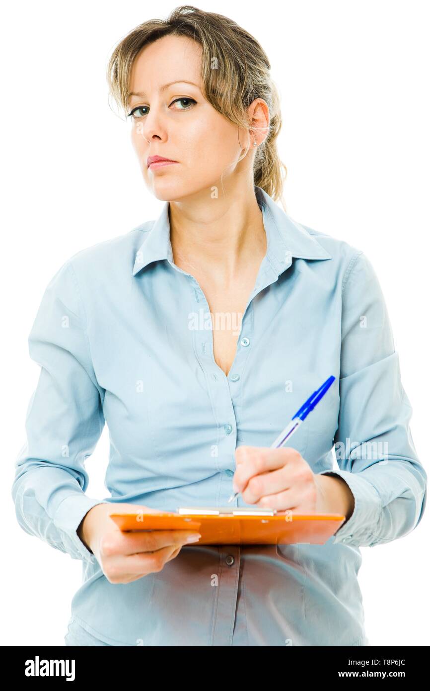 Business woman in blue shirt making notes and behaves strictly ...