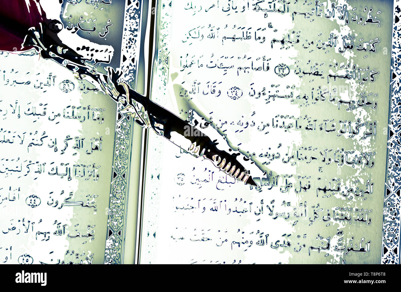 a pen and the holy book of Islam Stock Photo - Alamy