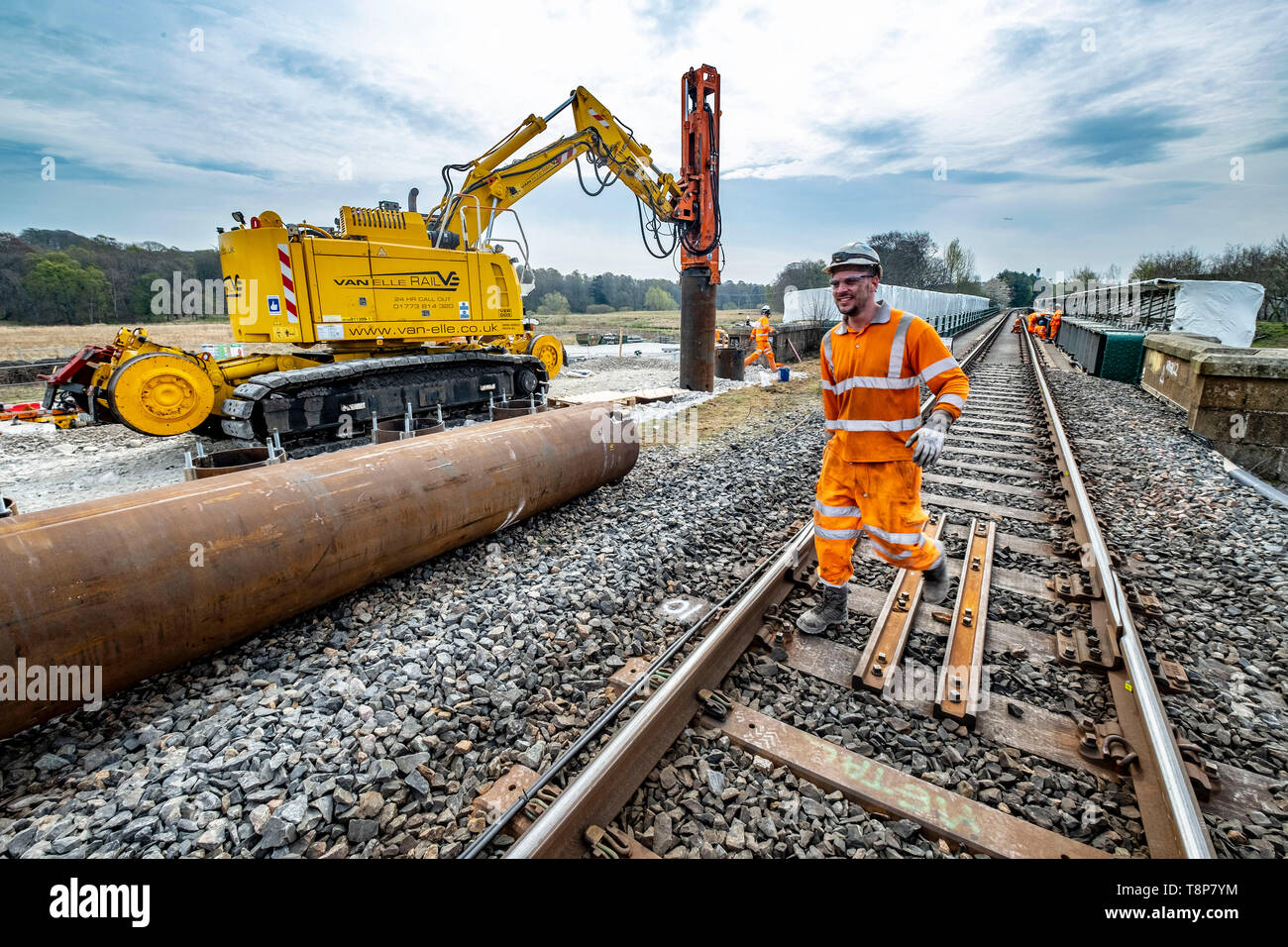 Railway workers constructing railway and core drilling Stock Photo - Alamy