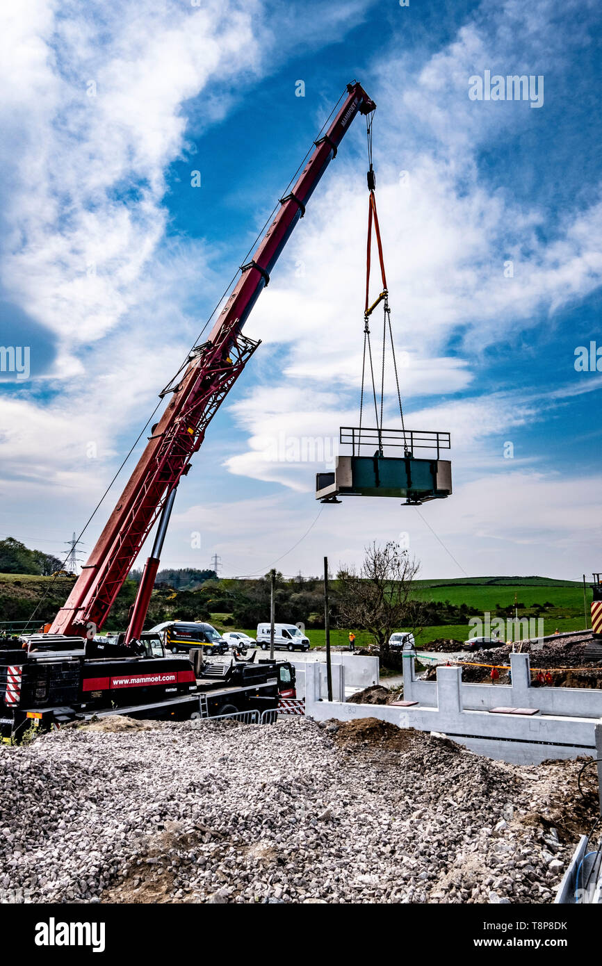 Rail bridge being lifted into place Stock Photo - Alamy