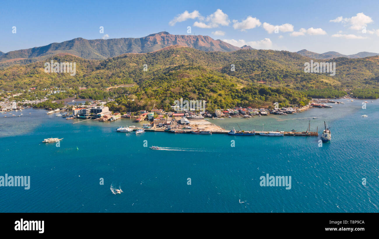 A small seaport in the City of Coron, Philippines.Big island with hills ...