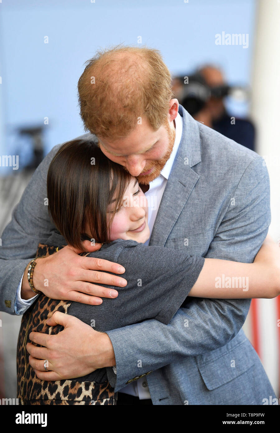 The Duke of Sussex embraces former patient Daisy Wingrove during a ...