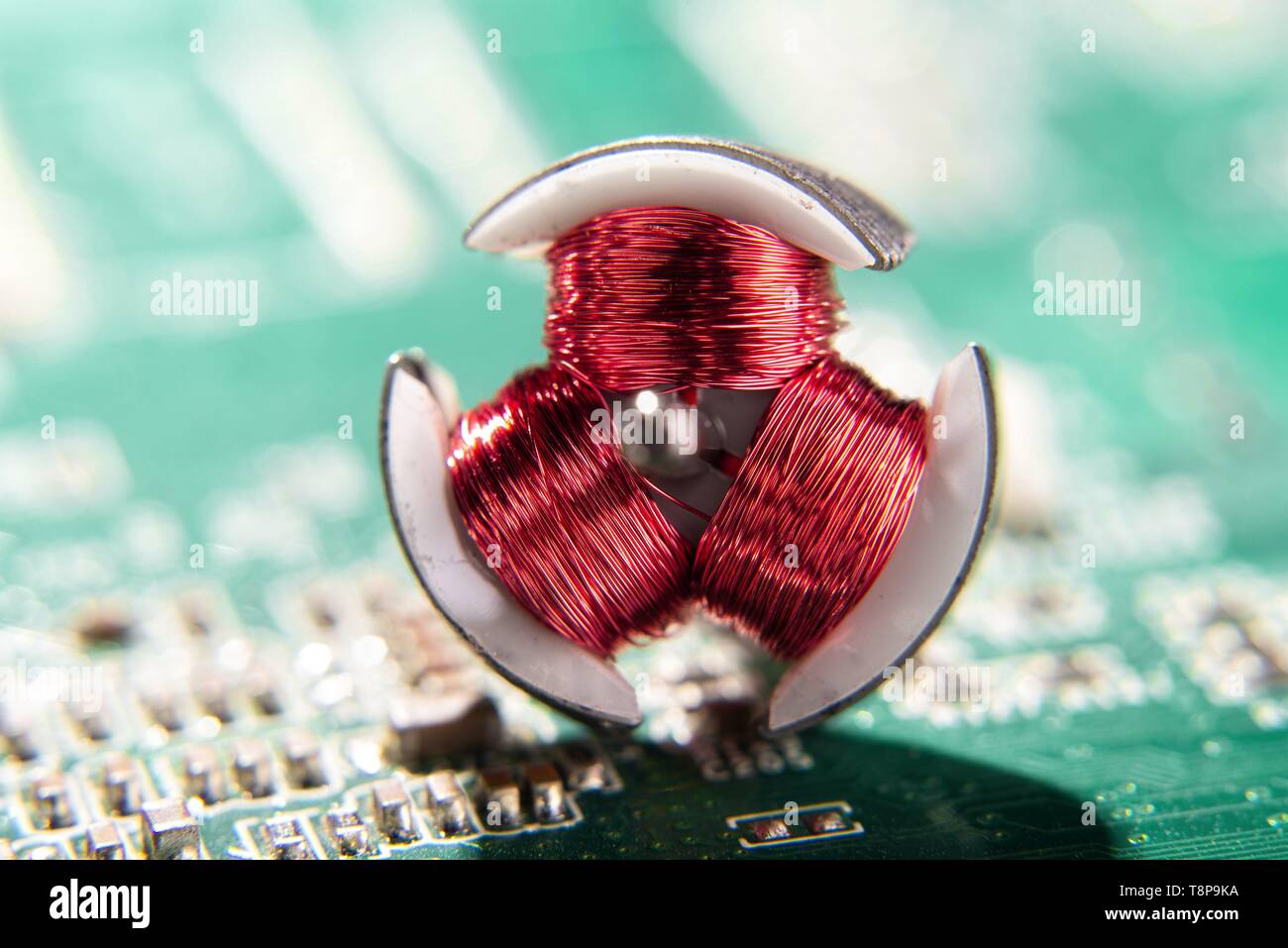 Red coils of an electric motor with circuit board | usage worldwide ...