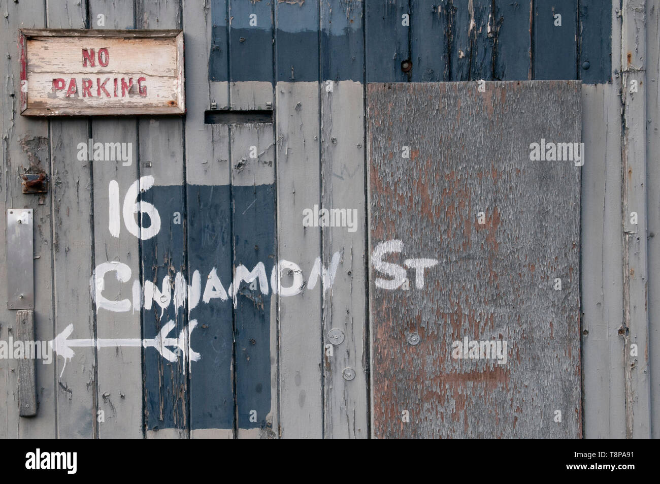 A Hand Painted Sign To An Address In Cinnamon Street On A Ramshackle ...