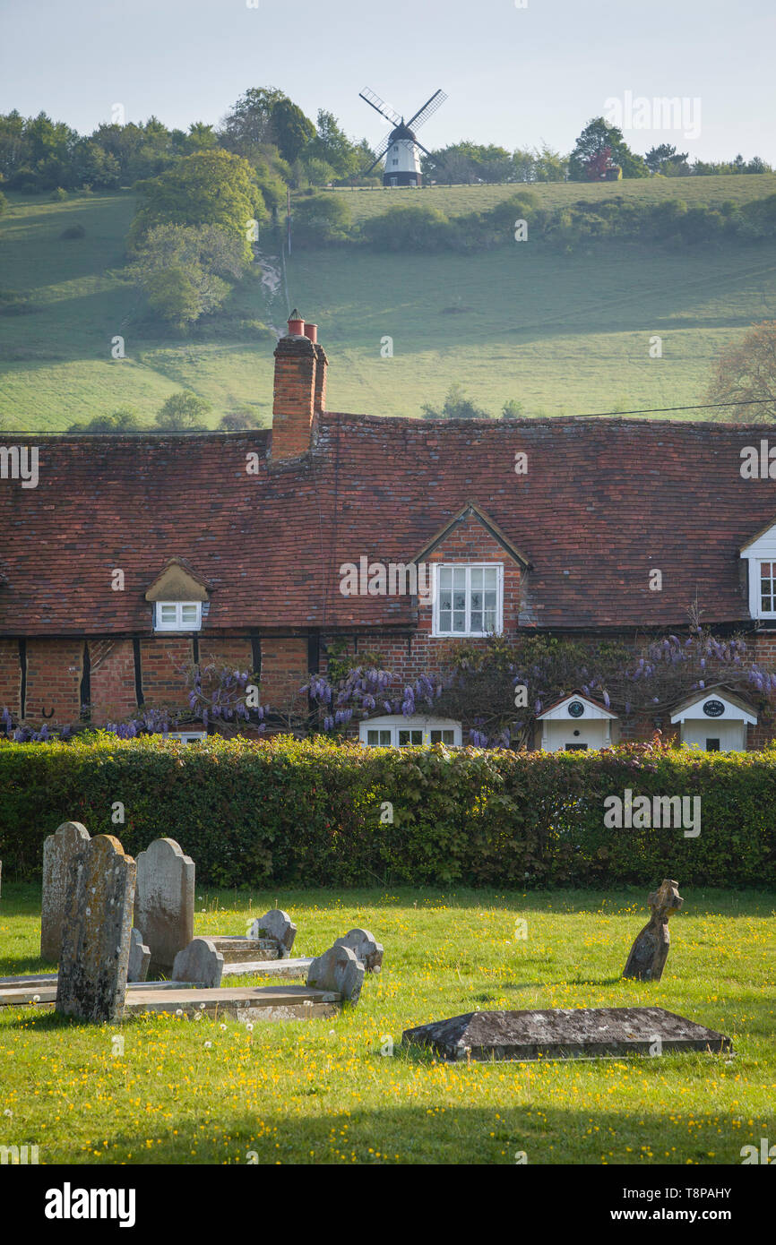 Period cottages in Turville viewed from across the churchyard with ...