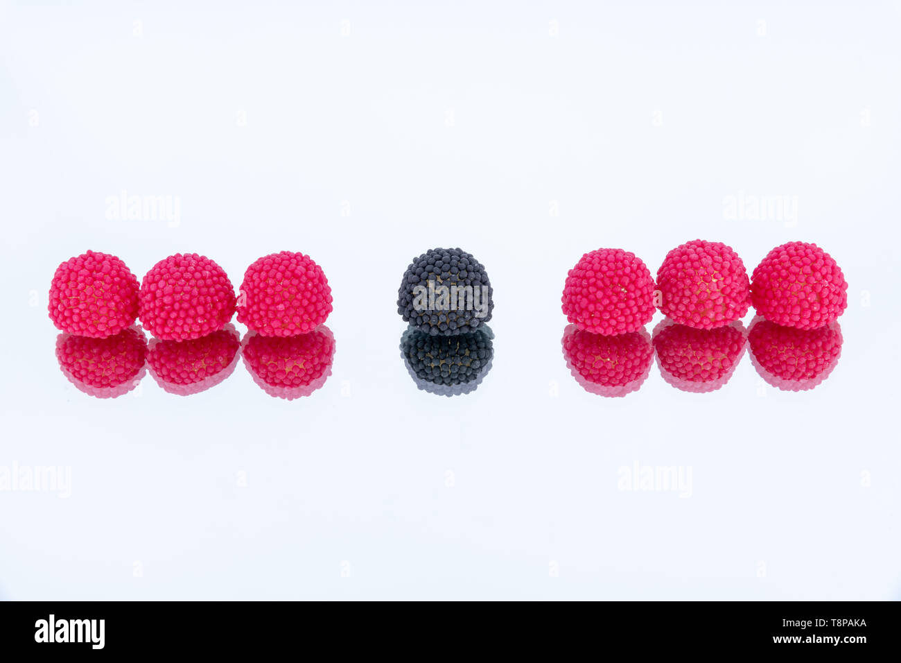 two colors of candies in a line Stock Photo - Alamy