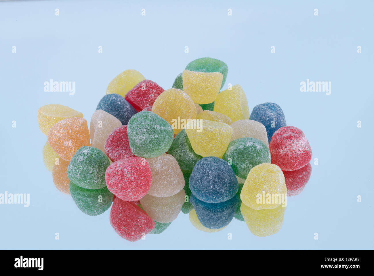 group of colorful gummies and and blue sky background Stock Photo - Alamy