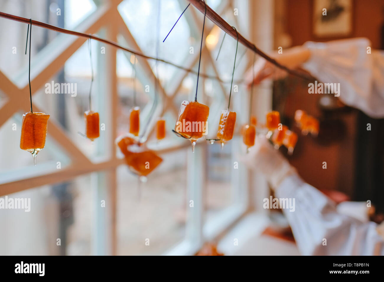 candies in caramel. cooking sweets at the factory, handmade Stock Photo ...