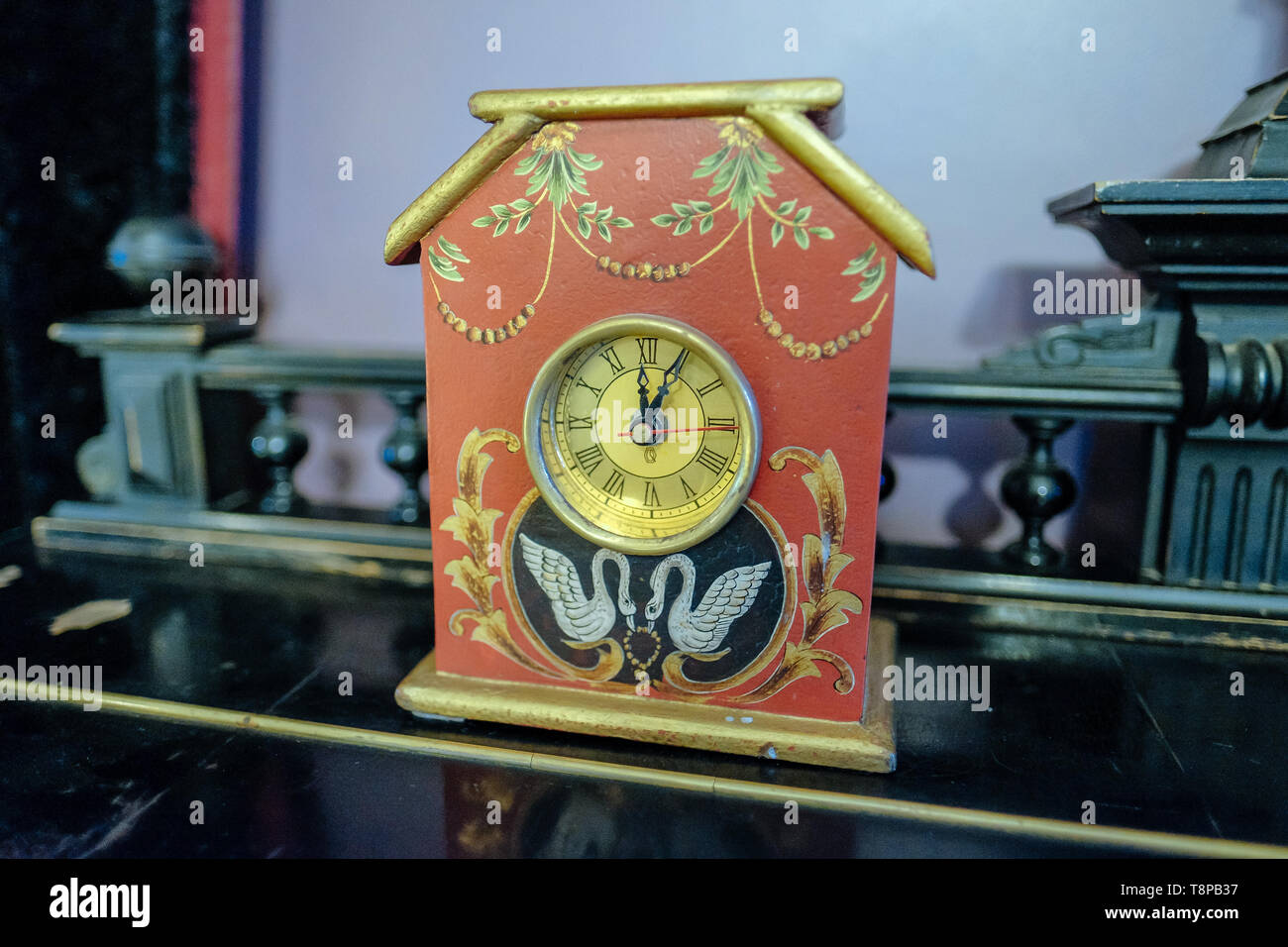 vintage clock stand on the piano Stock Photo - Alamy
