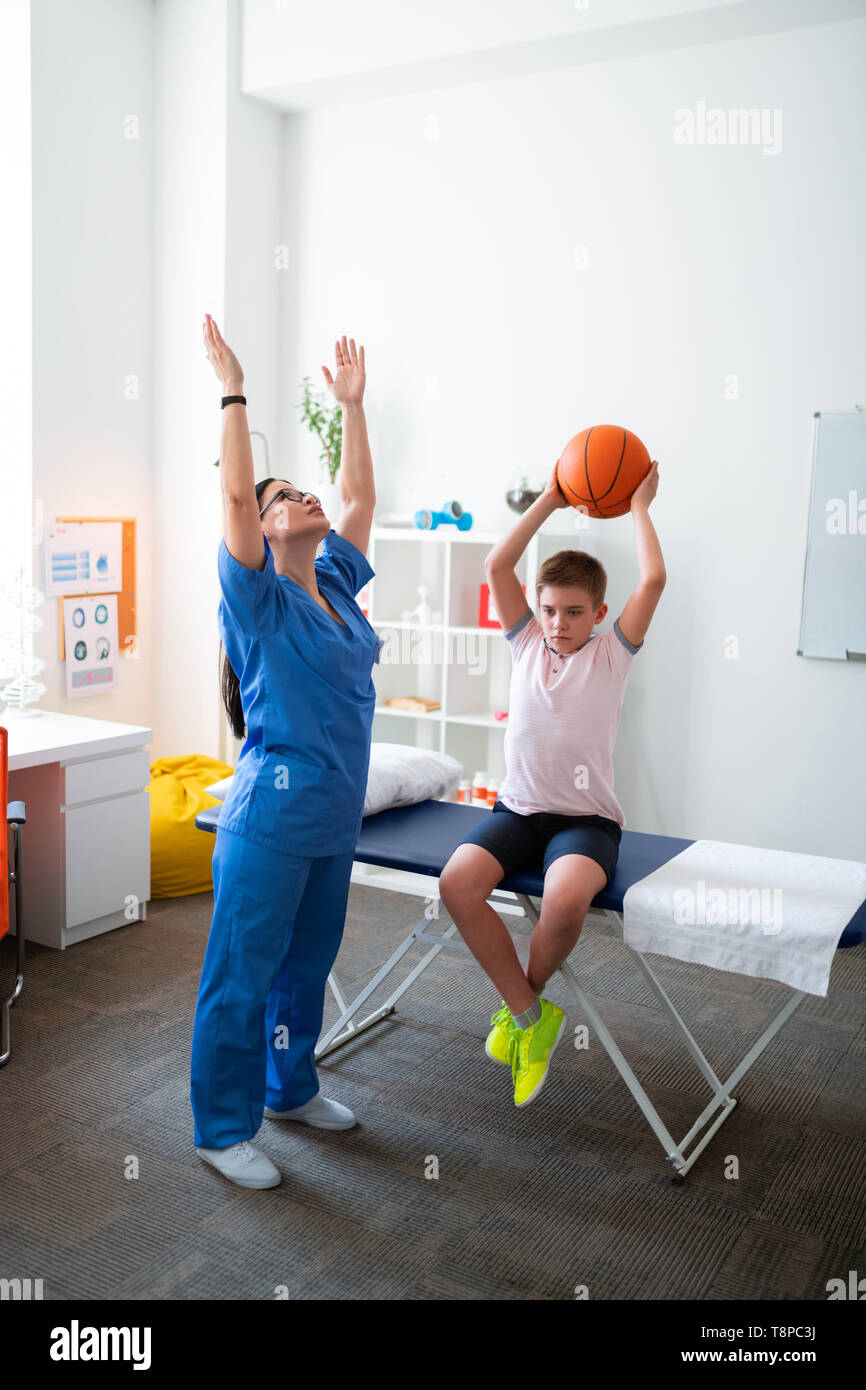 Active professional nurse being involved in treating session Stock ...