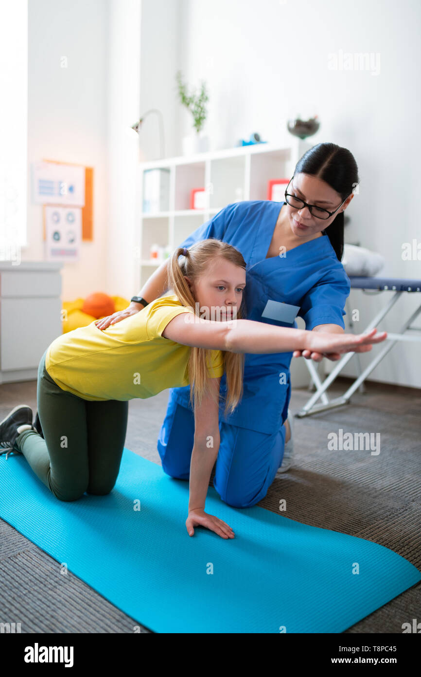 Hard-working girl wearing comfortable clothes while spending session ...