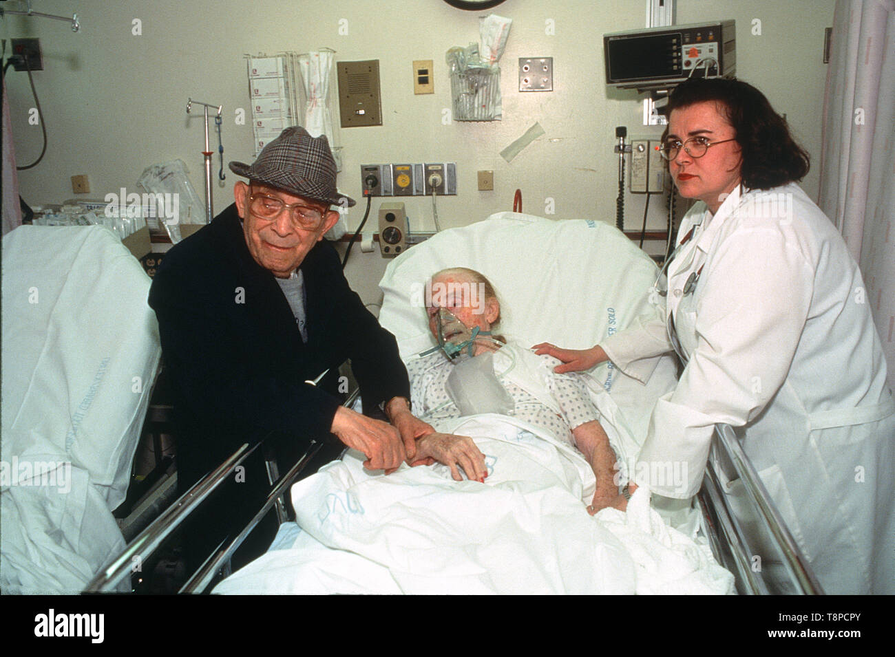 Emergency Room: Man comforts his wife with congestive heart failure ...