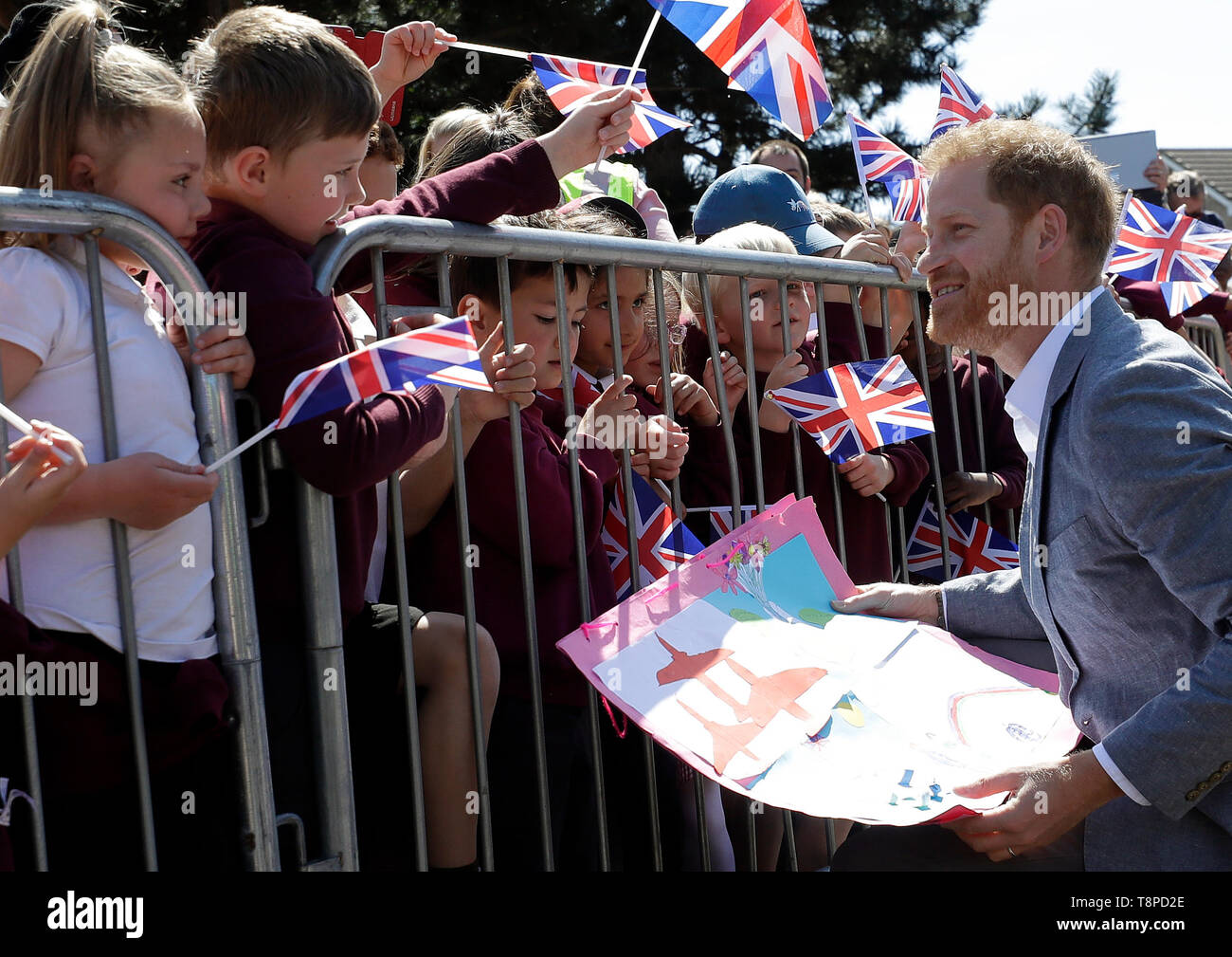 The Duke of Sussex meets children in the crowd as he arrives for a ...