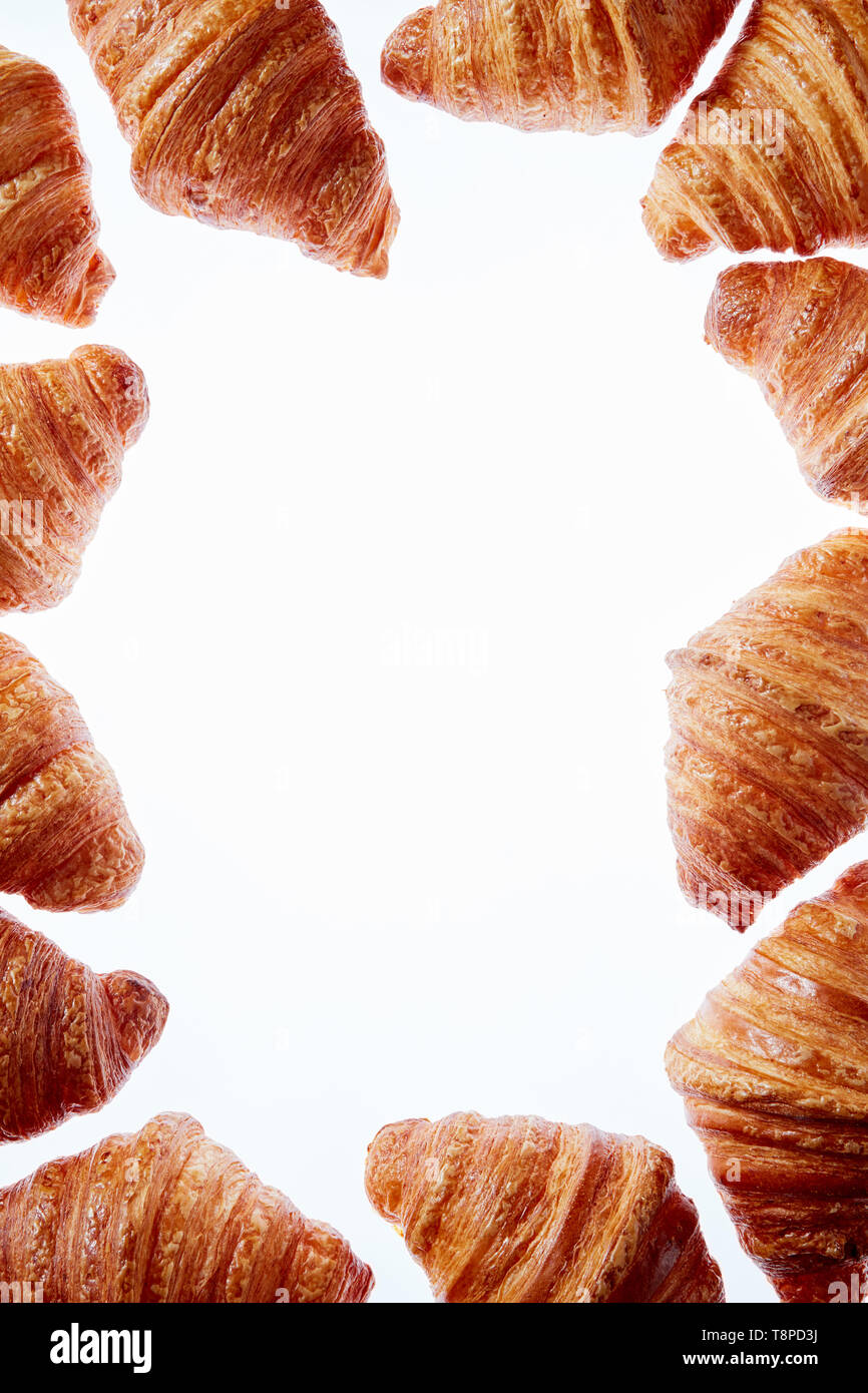 French croissants frame with copy space on a white background Stock ...