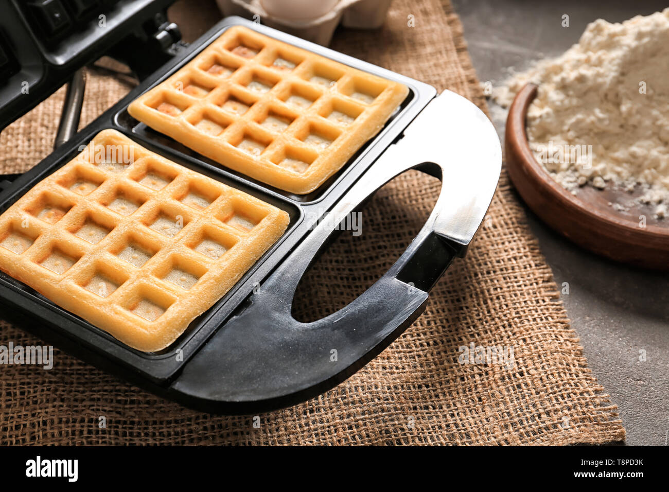 Cooking waffles in waffle maker hi-res stock photography and images - Alamy