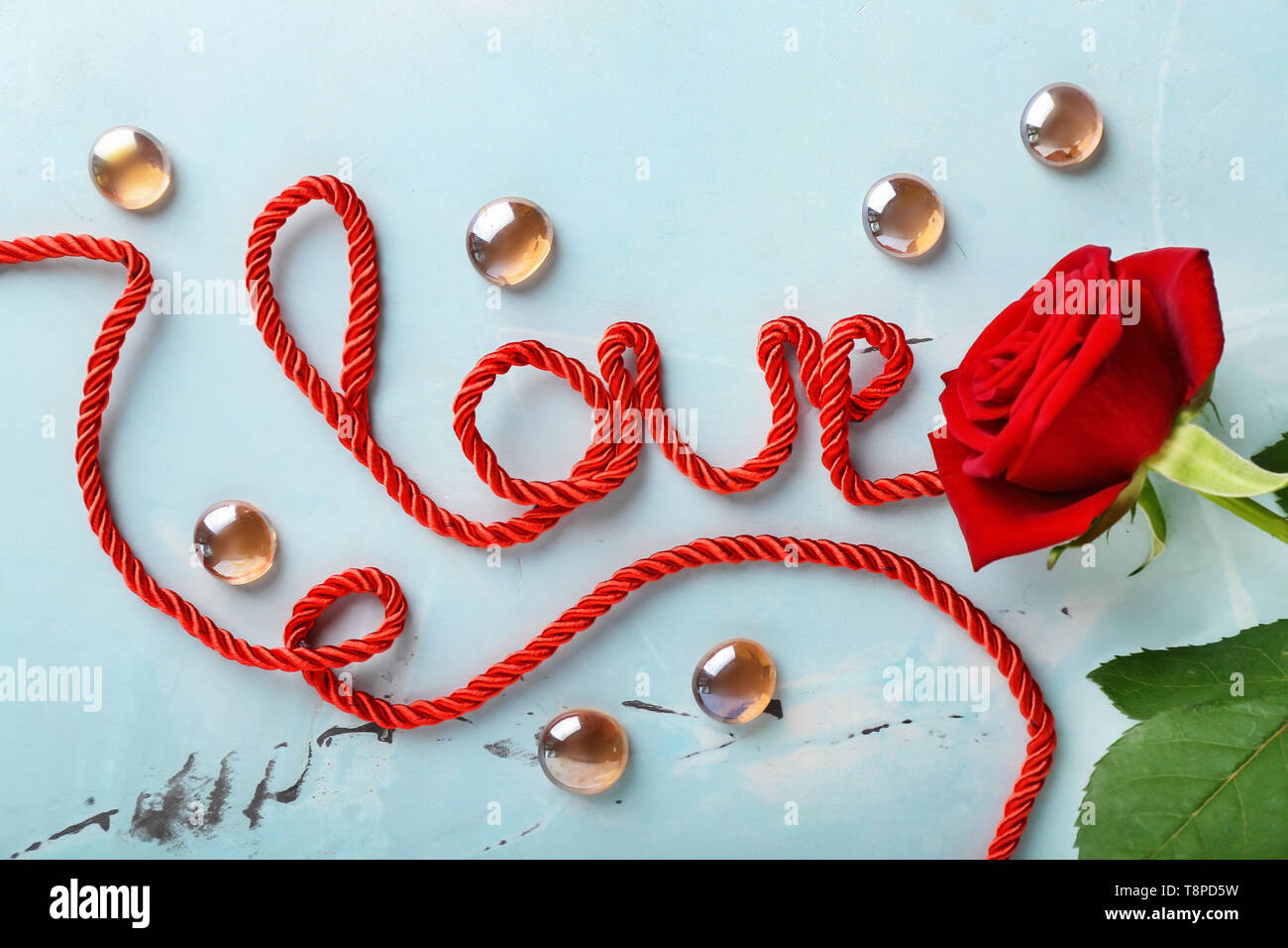 Composition with word LOVE on light background Stock Photo - Alamy