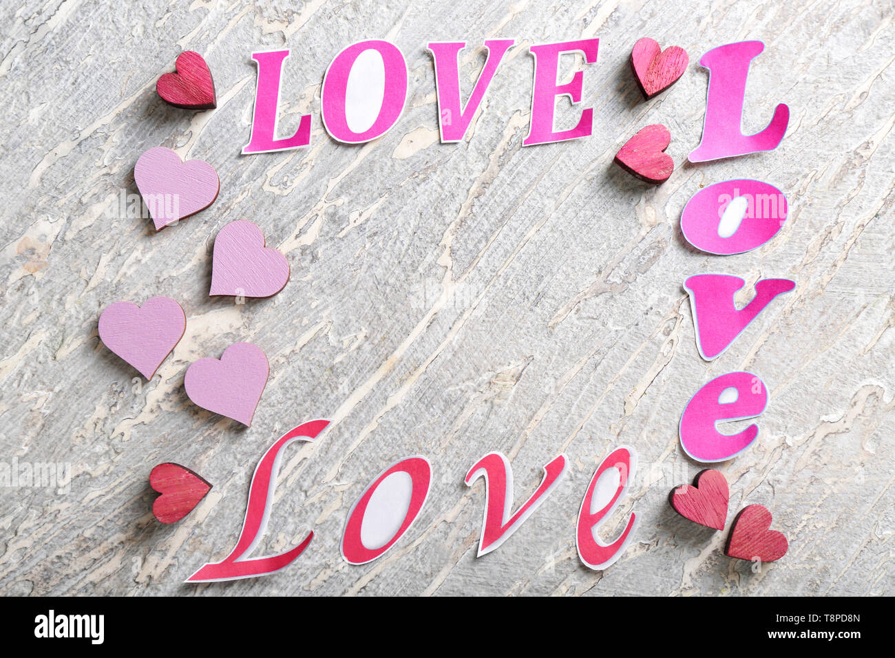 Words LOVE with color hearts on light background Stock Photo - Alamy