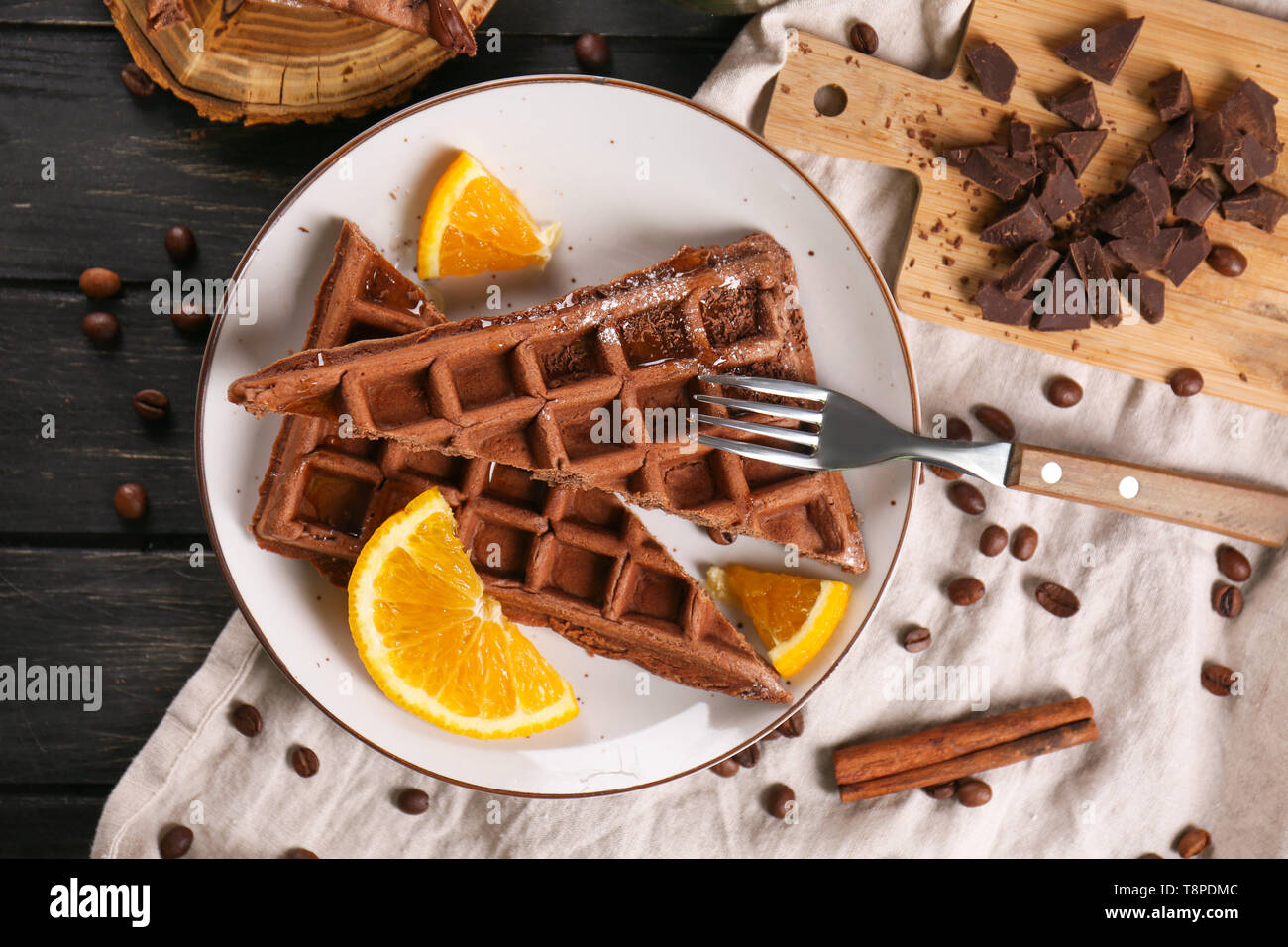 Delicious waffle with orange slices on plate Stock Photo - Alamy