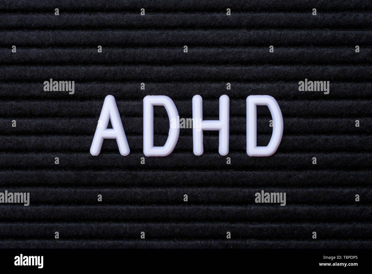 The abbreviation ADHD, on a letter board. ADHD stands for attention ...