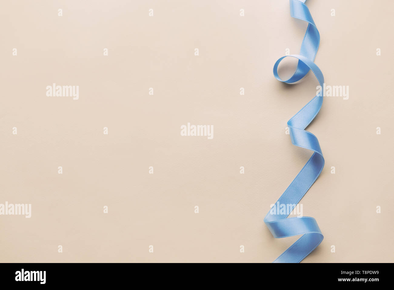 Beautiful blue ribbon on light background Stock Photo - Alamy