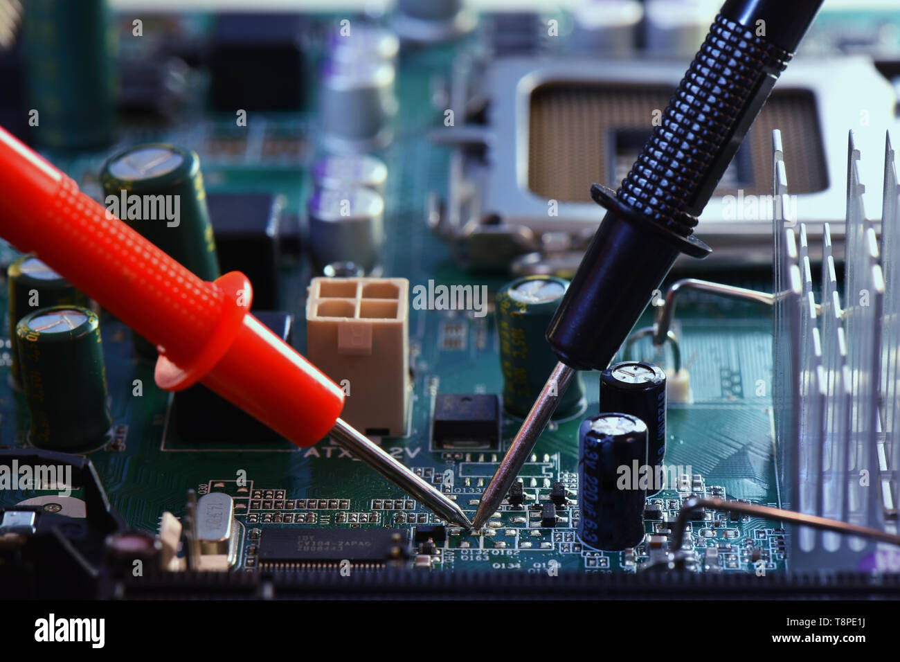 Close up needle tipped tip multimeter checking service repairing cpu ...