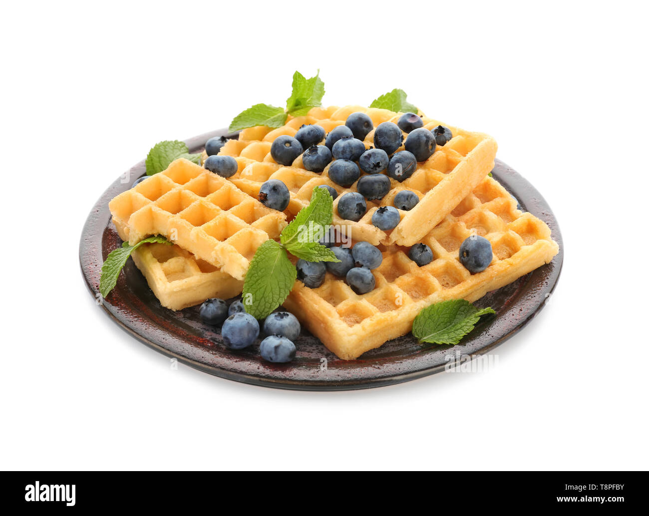 Plate with delicious waffles and blueberries on white background Stock ...