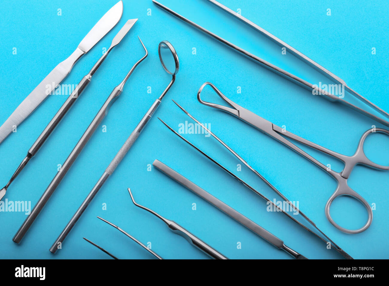 Dentist's tools on color background Stock Photo - Alamy