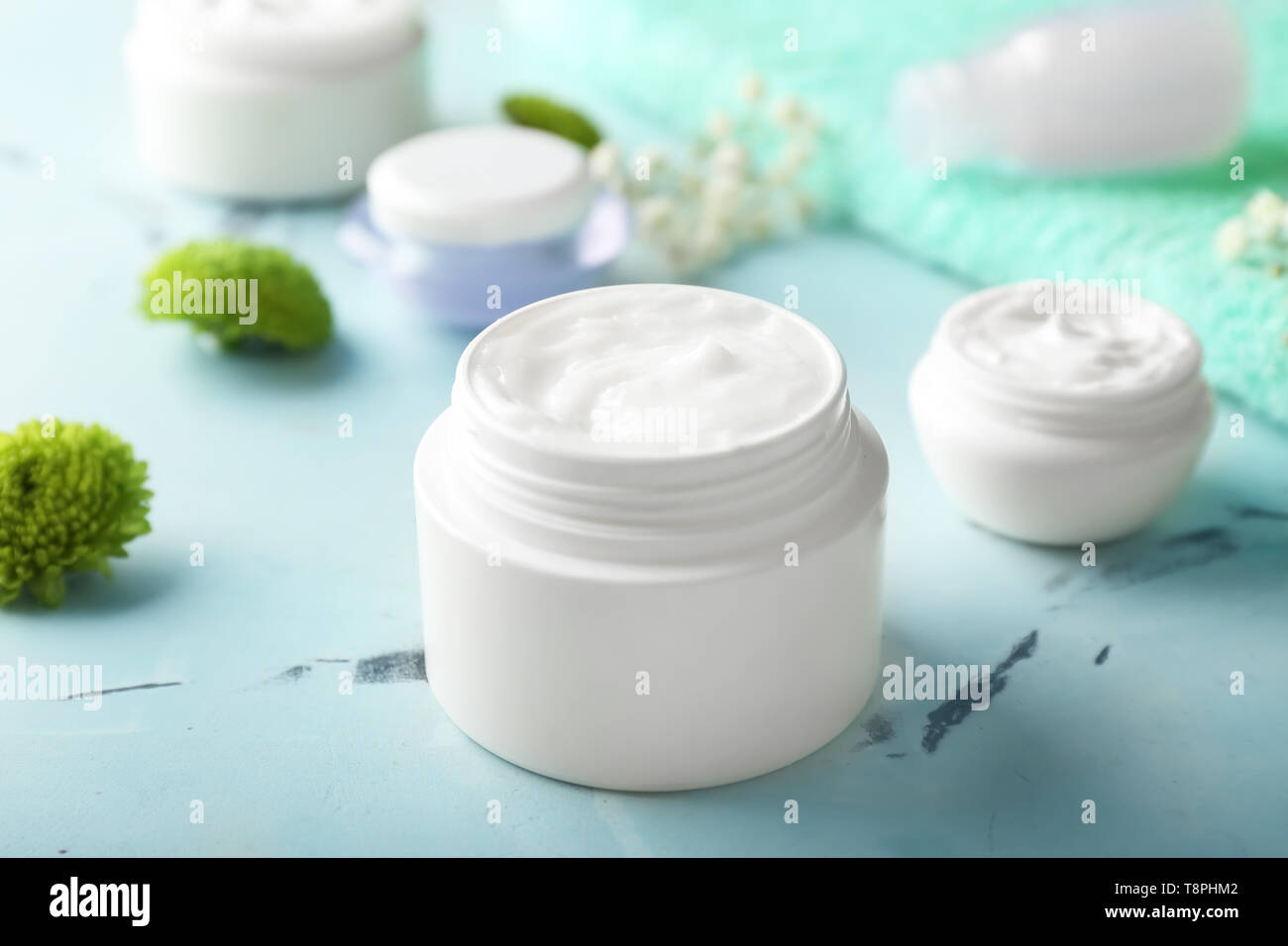 Jar with natural body cream on color table Stock Photo - Alamy