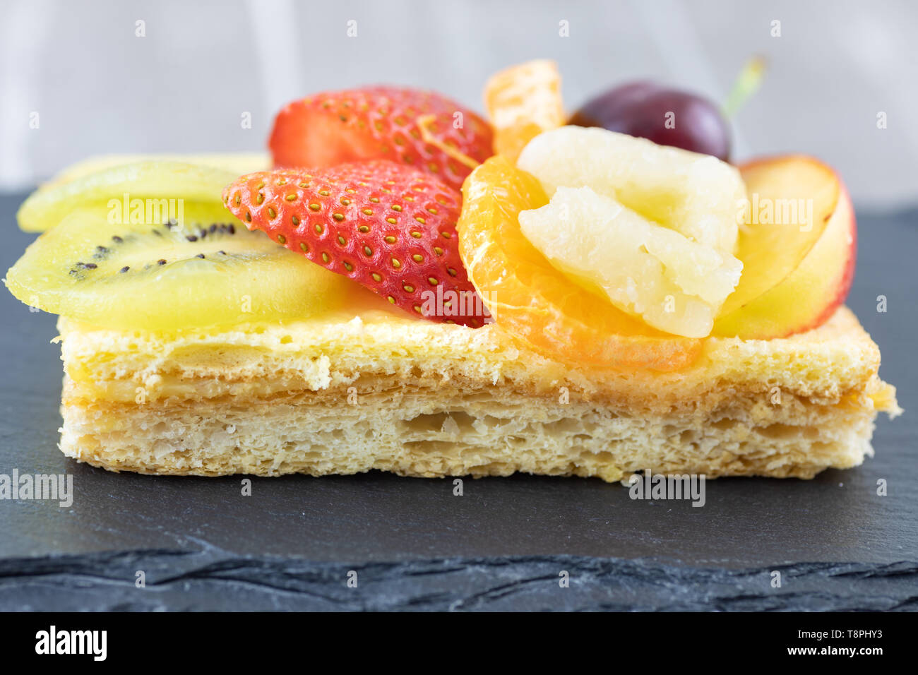 Puff pastry tart and seasonal fruits Stock Photo - Alamy